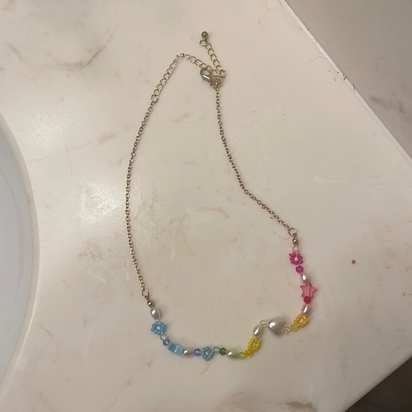Accessories | A Rainbow Chain Necklace With Different Types Of Designs ...